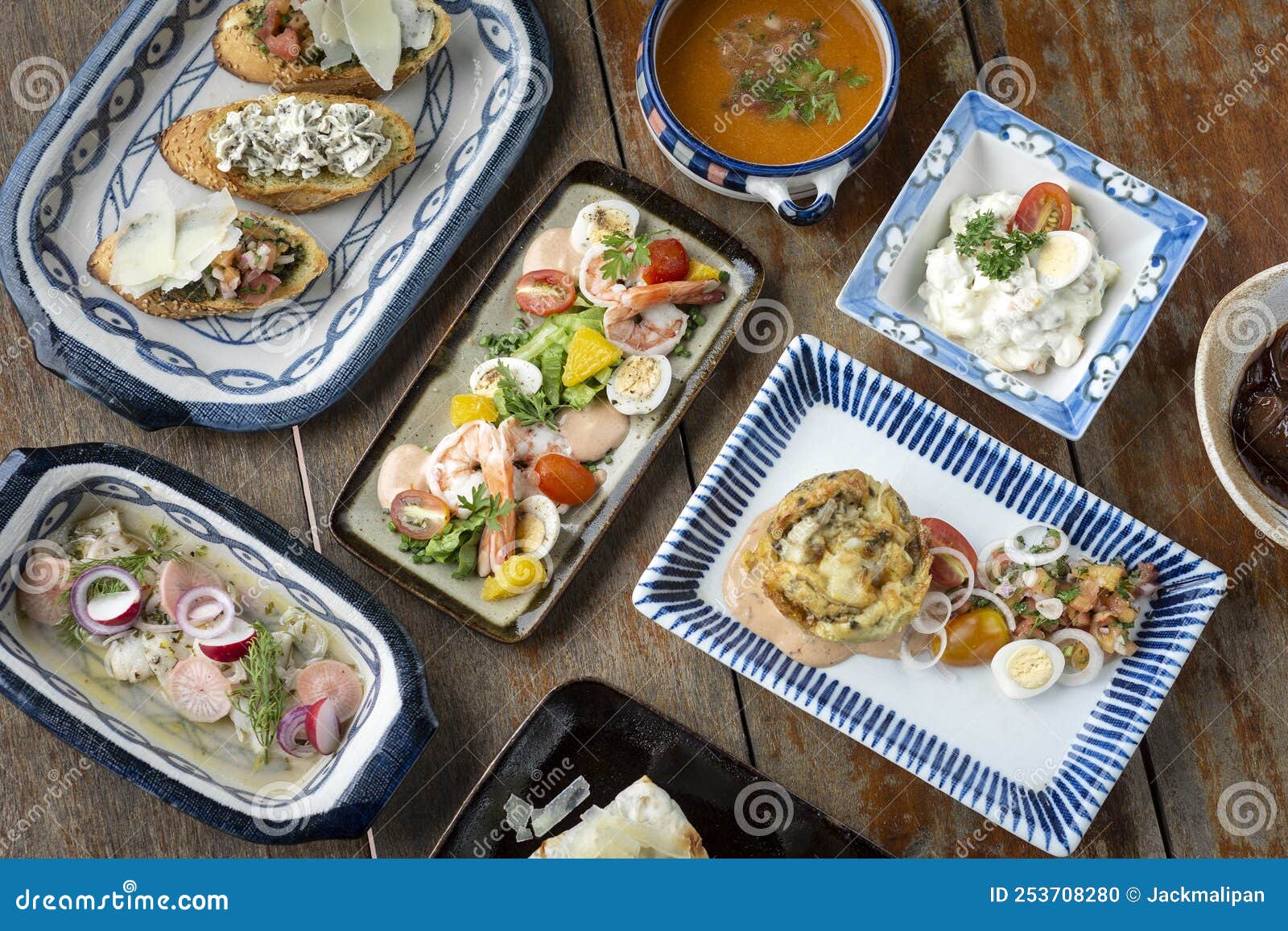 Selection of Many Different Tapas on Rustic Wood Table Stock Photo ...