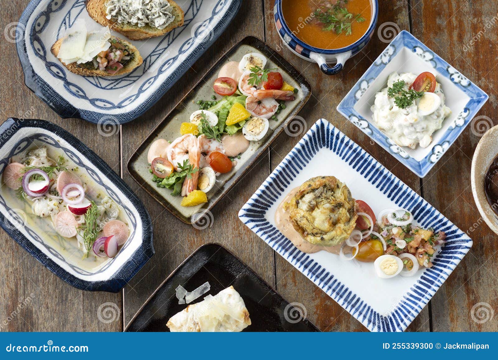 Selection of Many Different Tapas on Rustic Wood Table Stock Photo ...