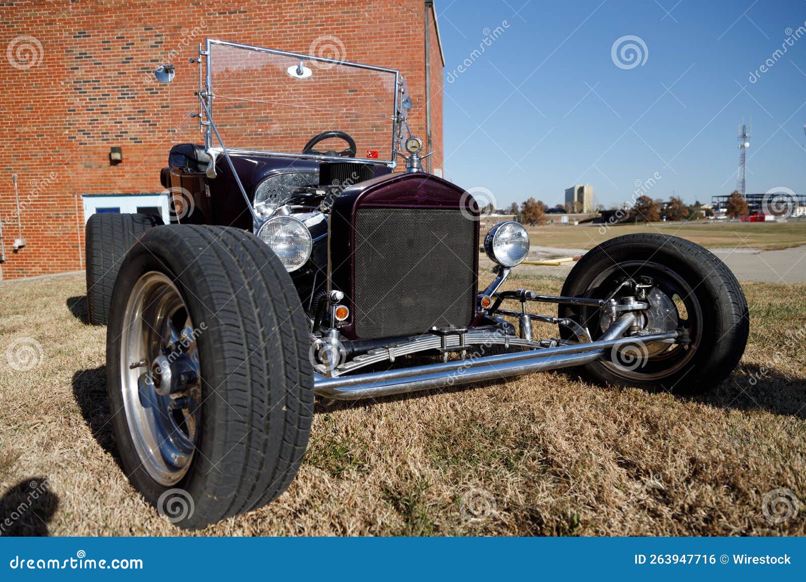 Selective Closeup Focus of a Vintage Ford Model T in Front of a Red ...