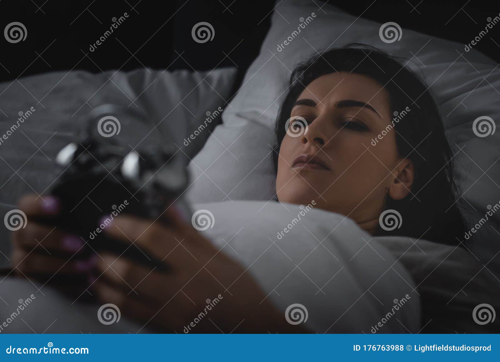 Focus of Awake Woman Looking at Alarm Clock Stock Photo - Image of ...