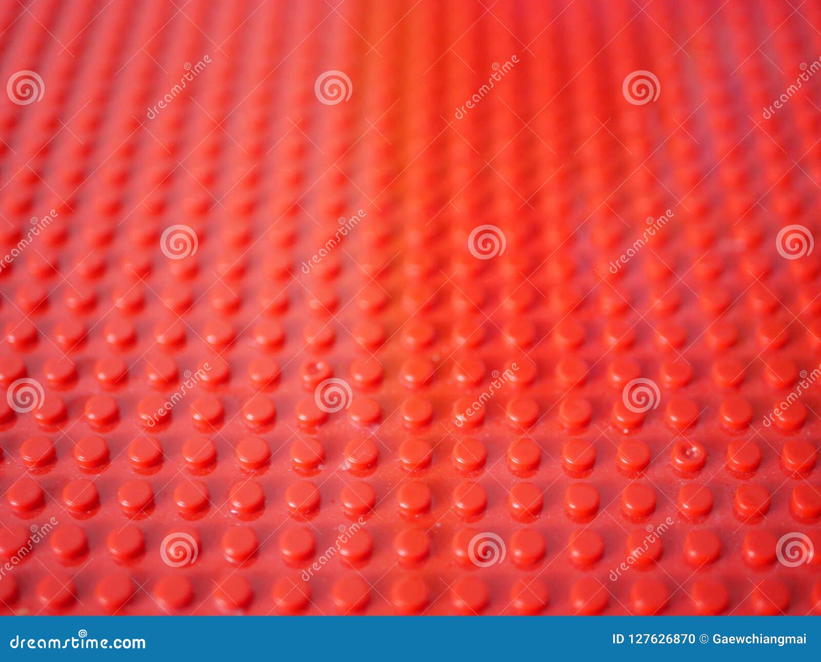 Background of Red Plastic Sheet Filled with Round Knots Stock Photo ...