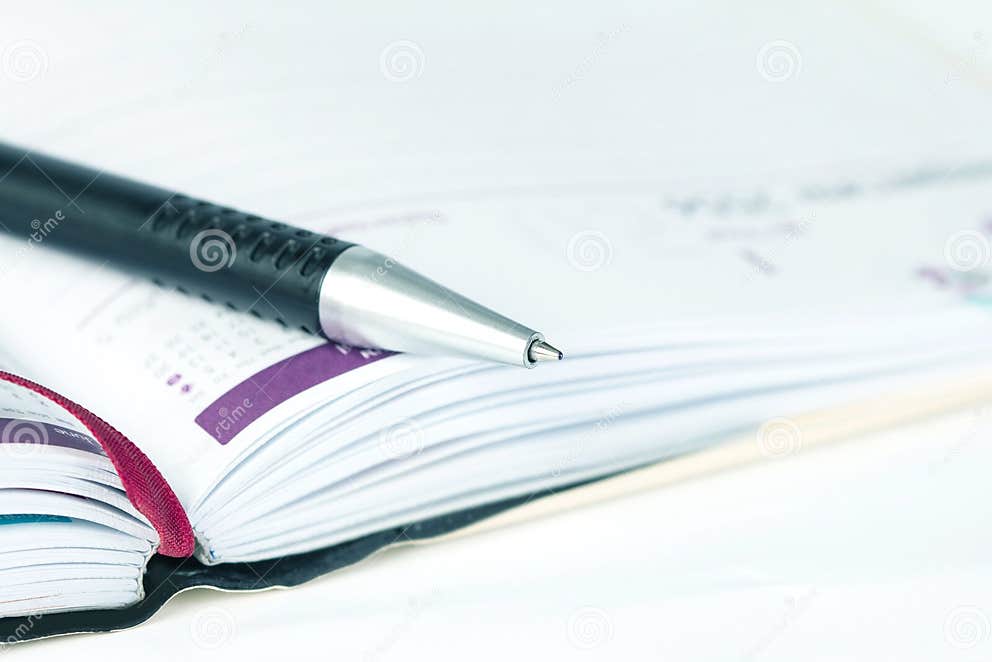Selective Focus of Ball Pen on Opened Lined Diary Book with Calendar ...