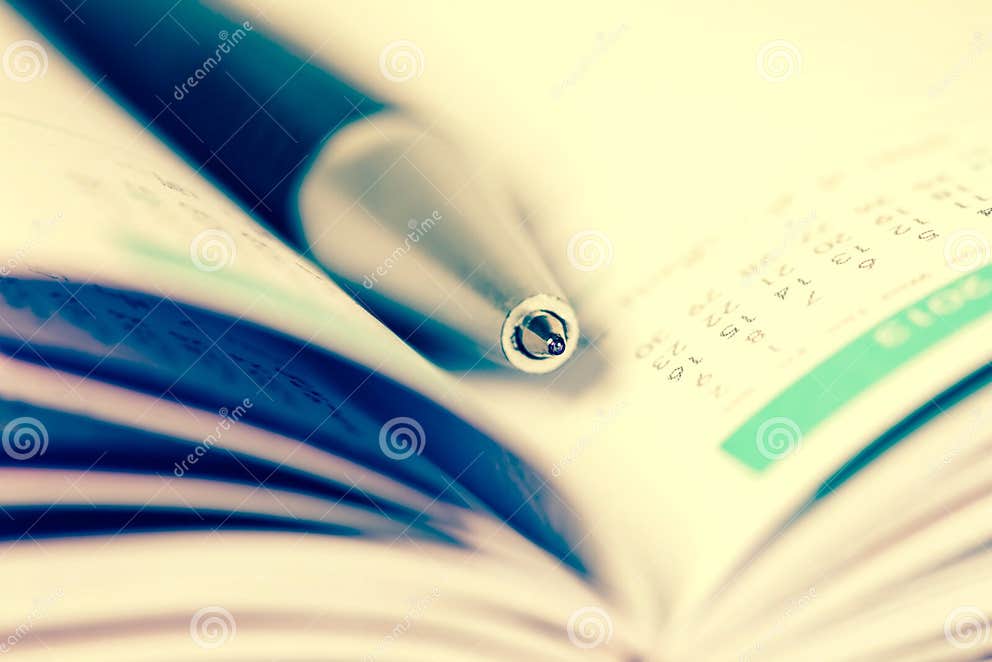 Selective Focus of Ball Pen on Opened Lined Diary Book with Calendar ...