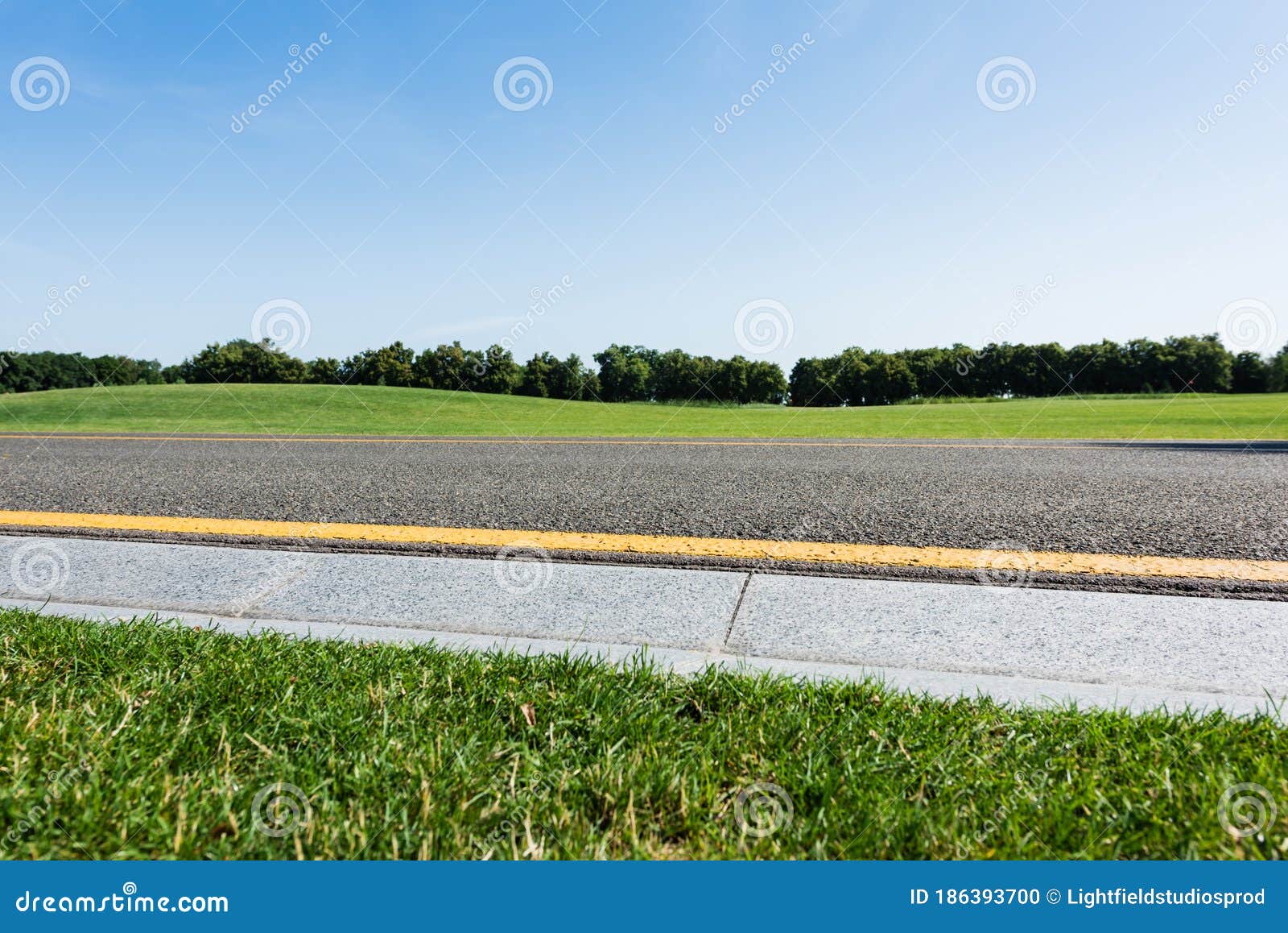 Selective Focus of Border Near Yellow Line and Road Stock Photo - Image ...
