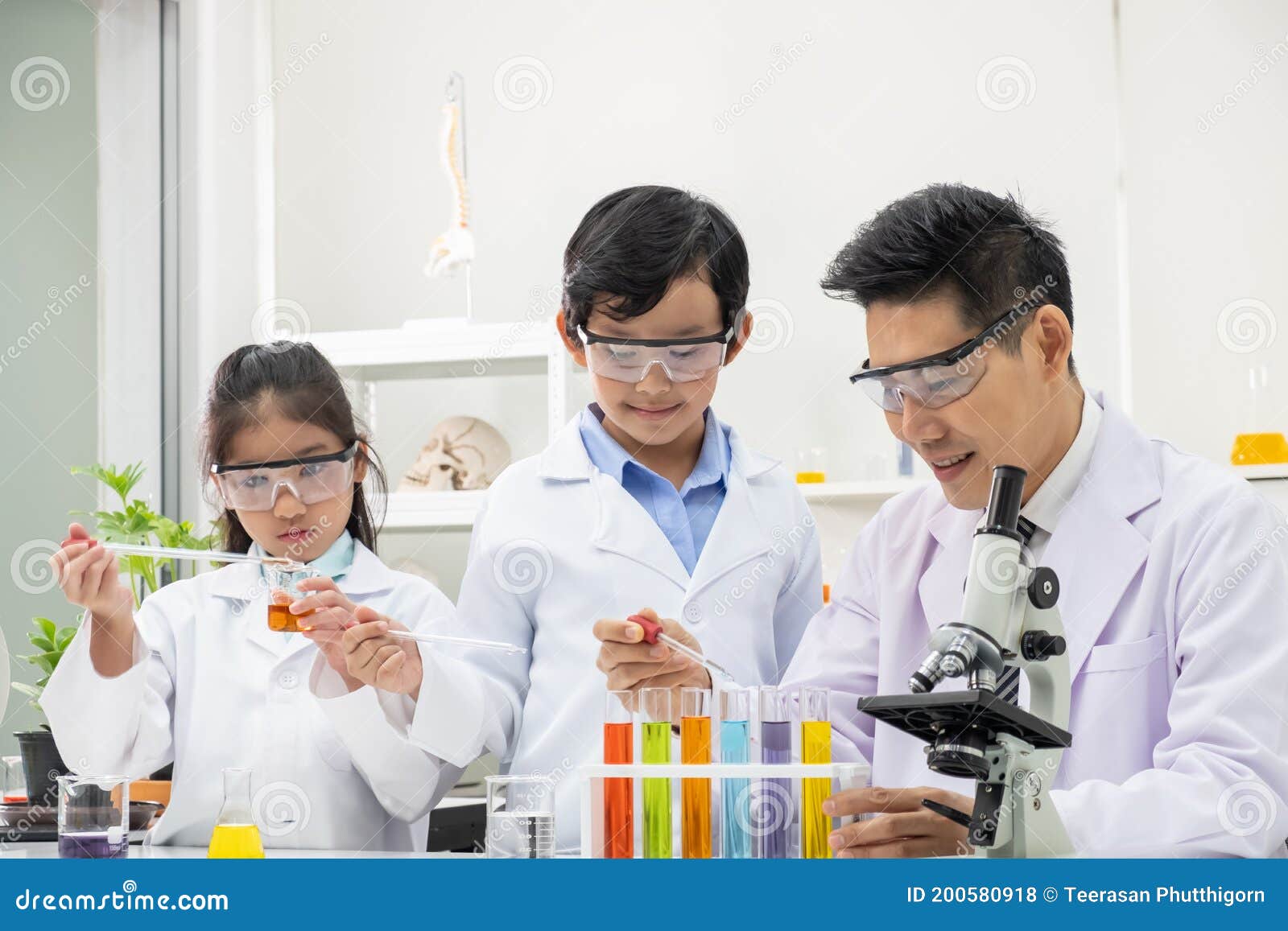 Selective Focus at Boy Face. Young Asian Boy and Girl Study Science ...