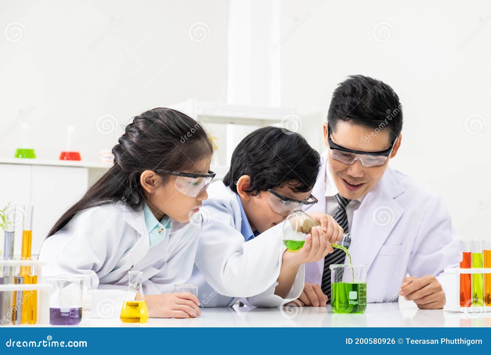 Selective Focus at Boy Face. Young Asian Boy and Girl Study Science ...