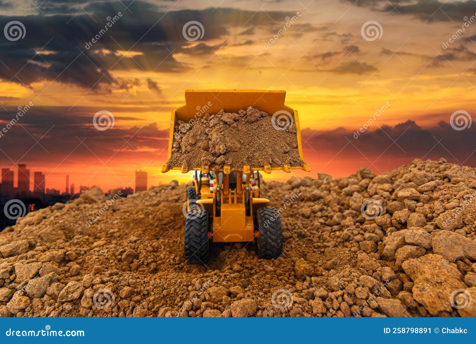 Selective Focus with Bucket,Wheel Loader are Digging the Soil in the ...