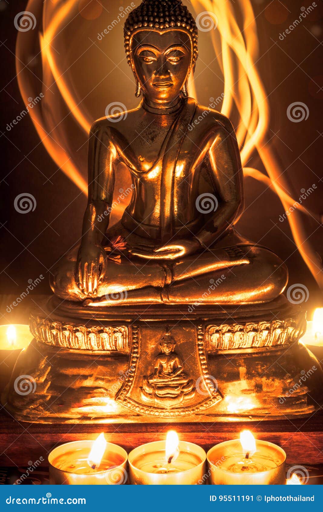 Selective Focus of Buddha Statue with Blurred Burning Candle Light in ...