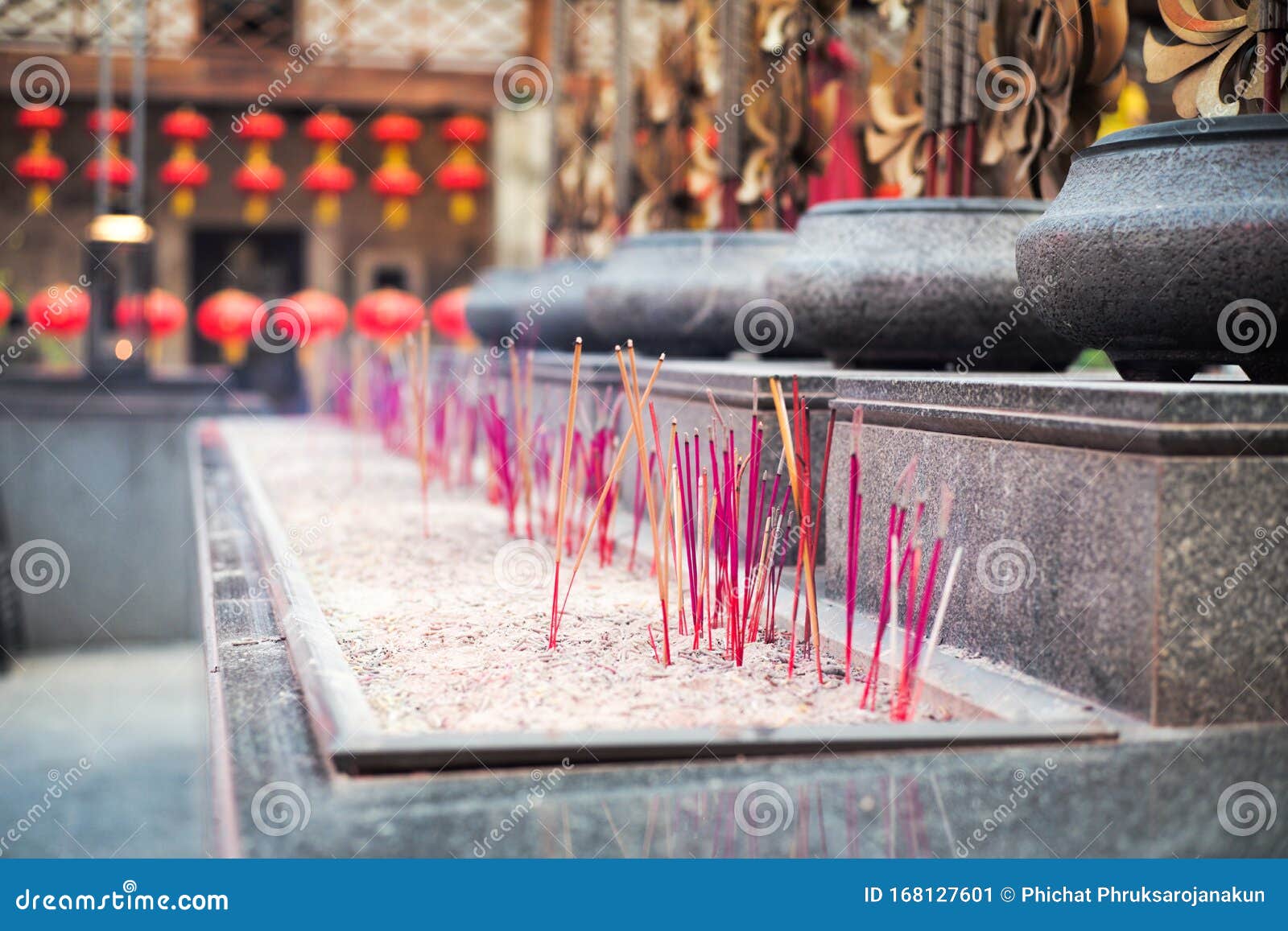 Selective Focus on Bundle of Fired Incenses Put in Sand Tray with ...