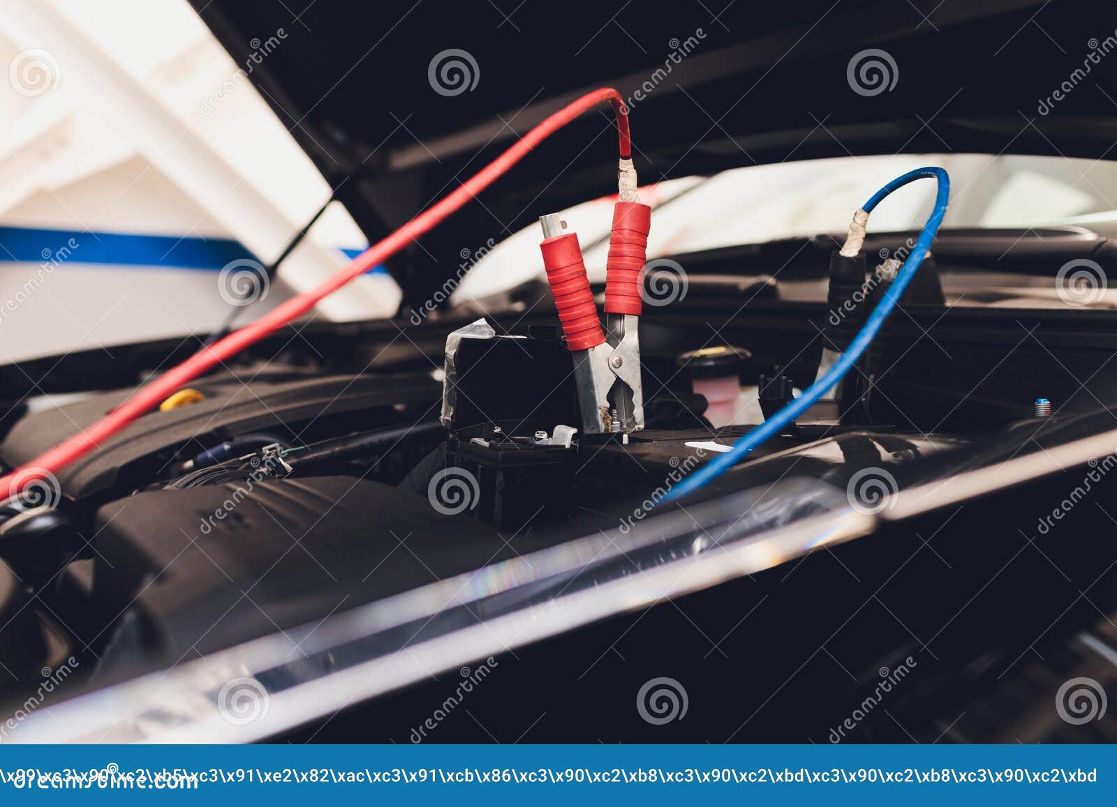 Selective Focus Charging Car with Electricity Trough Cables. Stock ...