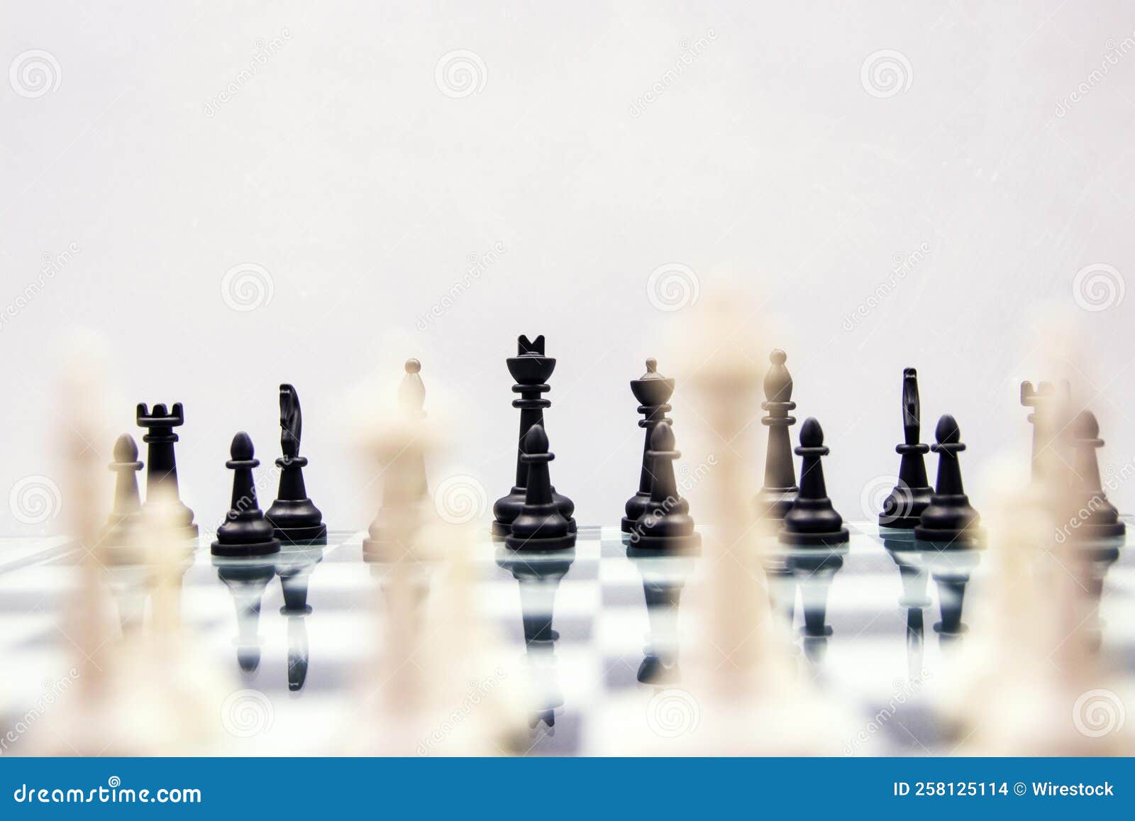 Selective Focus of Chess Pieces on a Glossy Chessboard on White ...