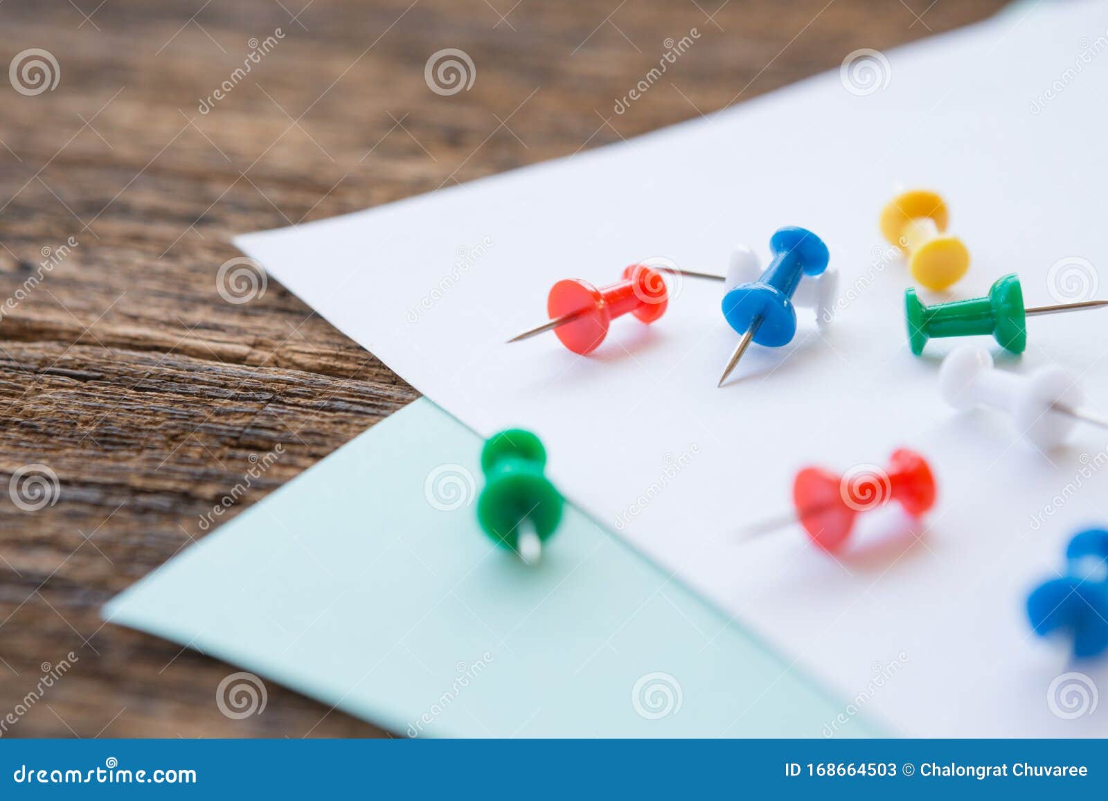 Selective Focus of Colorful Many Pins on Notepad Paper on Wood Board ...