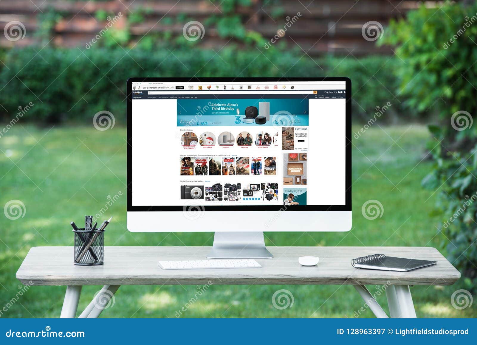 Selective Focus of Computer Monitor with Amazon Website at Table ...