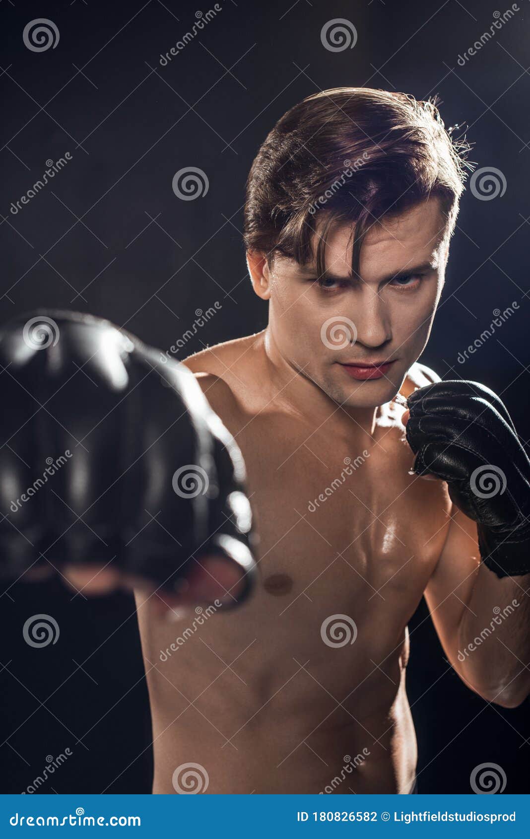 Selective Focus of Concentrated Boxer in Boxing Gloves Training and ...