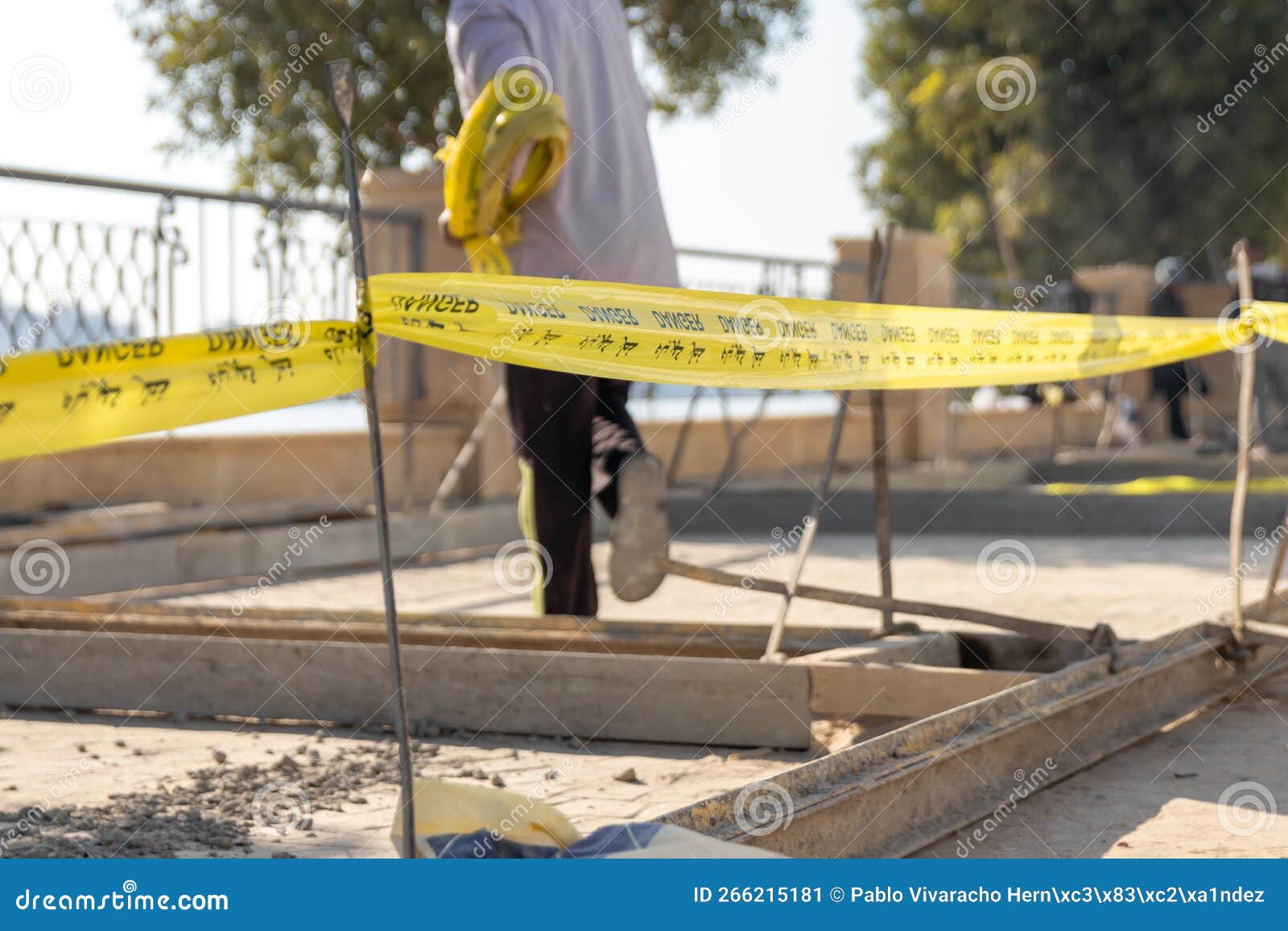 Selective Focus of Danger Yellow Cord in a Construction Site with an ...