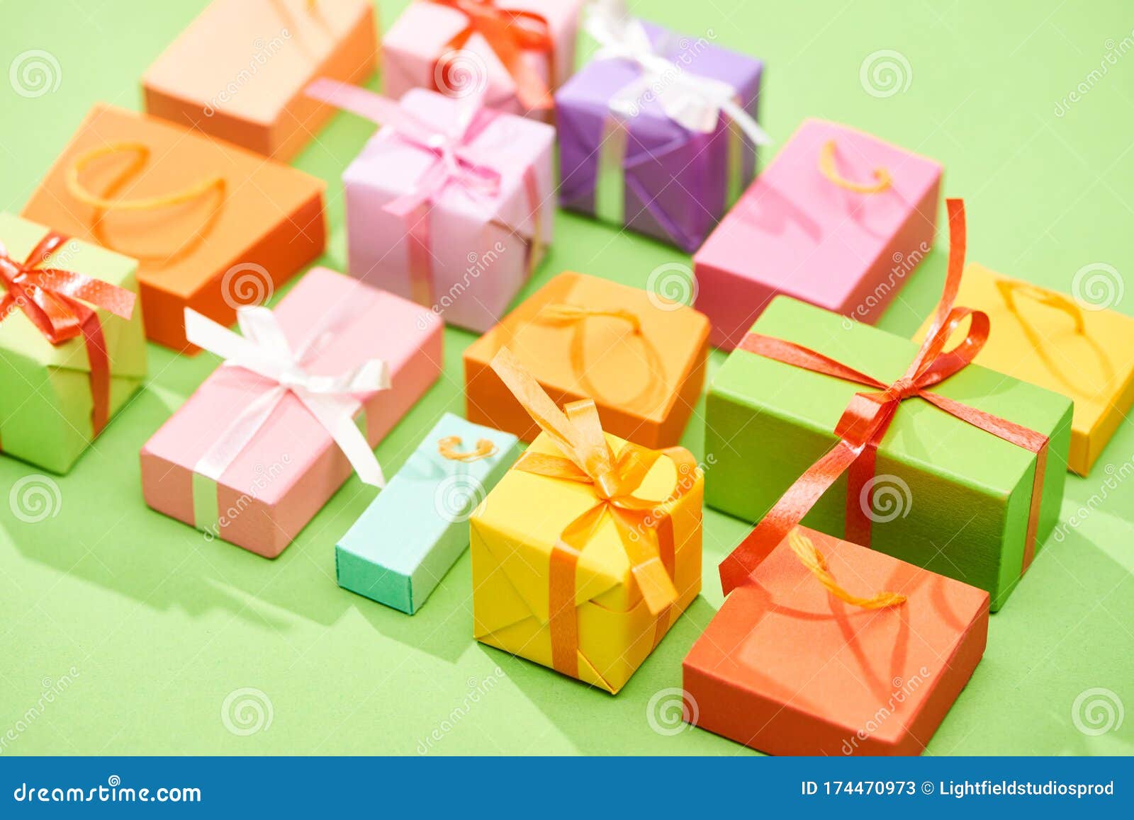 Selective Focus of Decorative Colorful Gift Boxes on Green Background ...
