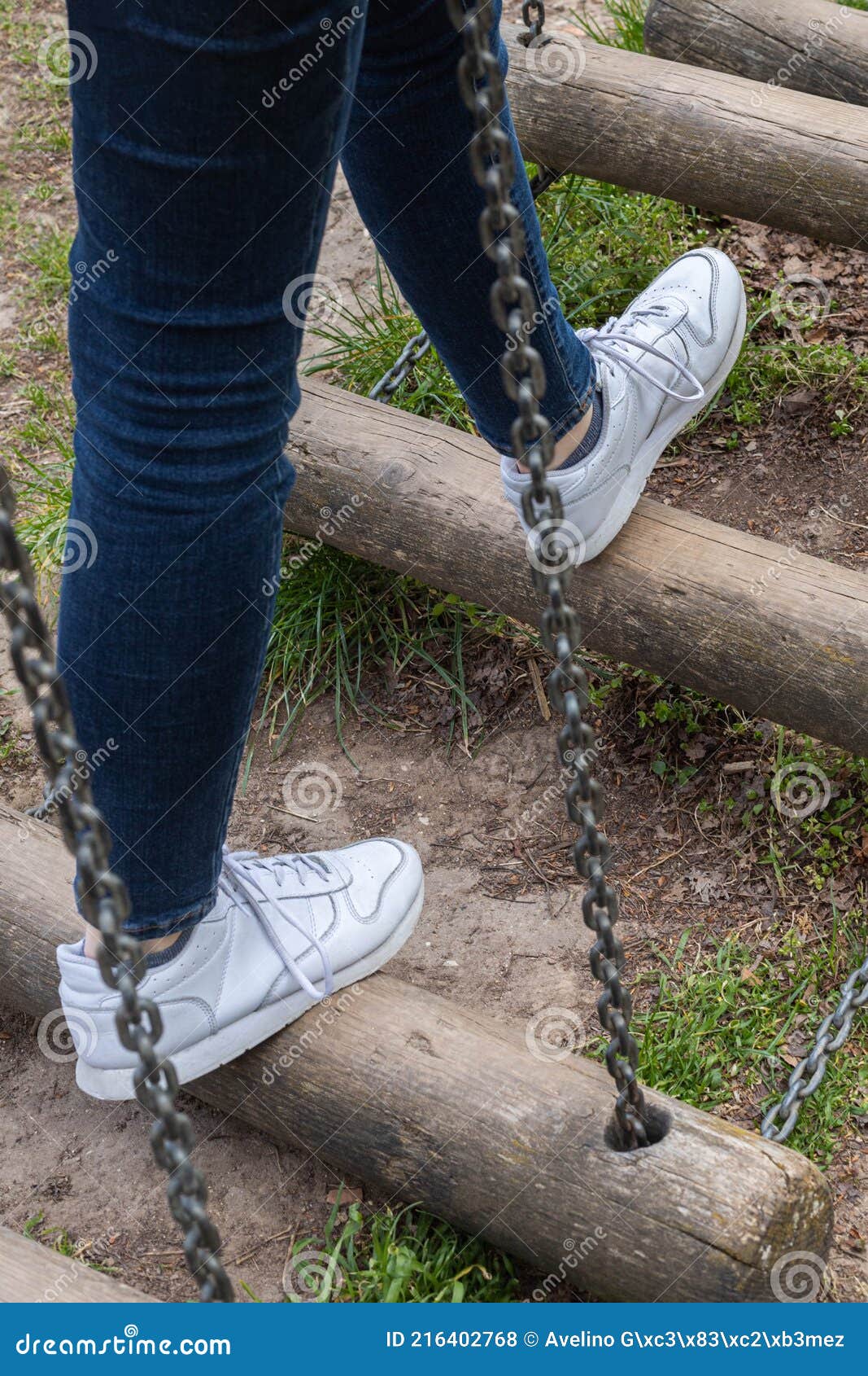 Selective Focus on the Detail of Legs Crossing a Bridge Made of Tree ...