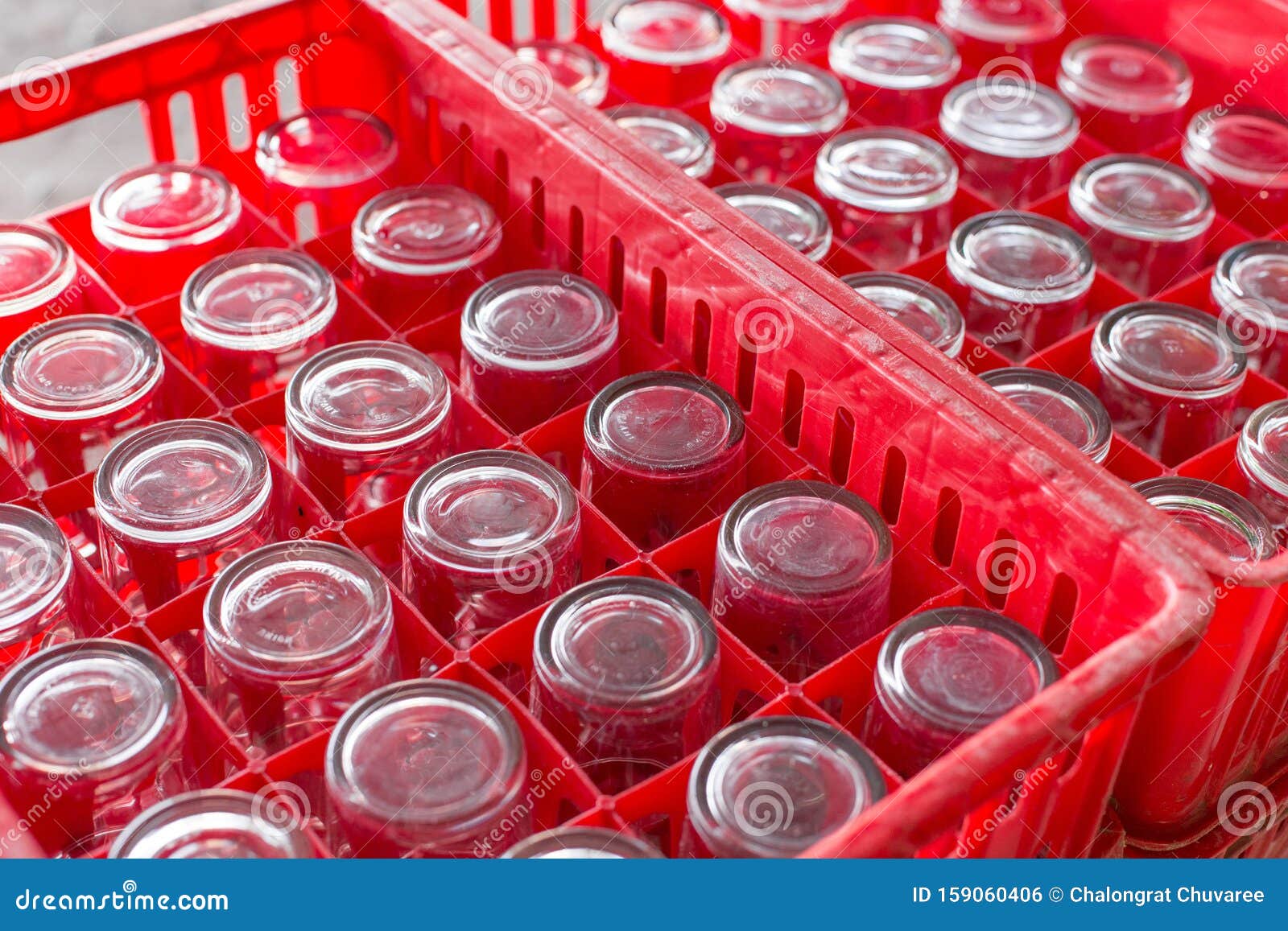 Selective Focus of Drinking Glass in Red Plastic Crates Stock Photo ...