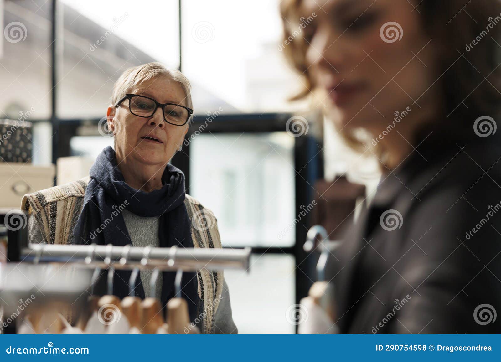 Selective Focus of Elderly Customer Asking Employee for Help Stock ...