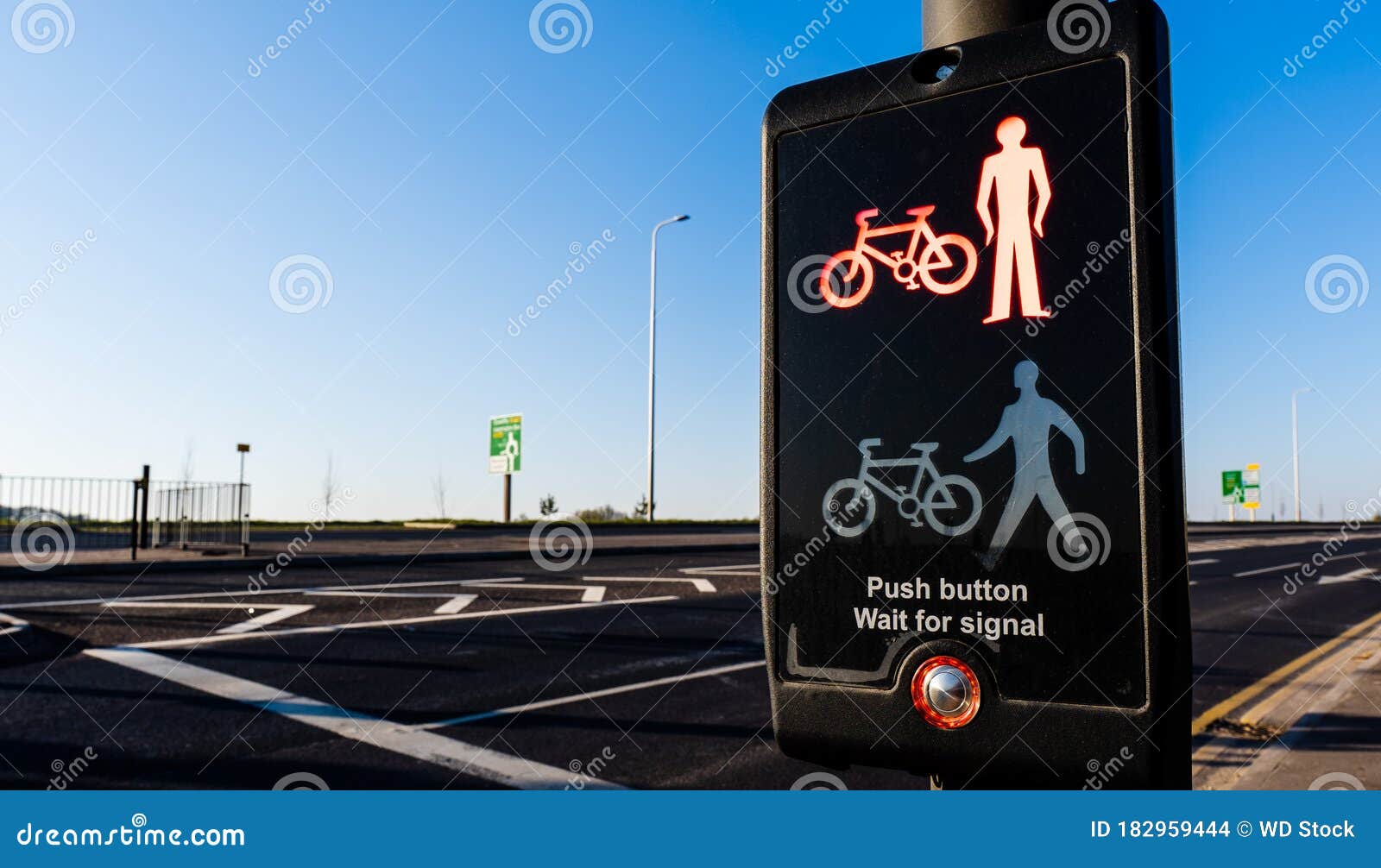 Illuminated Do Not Cross or Walk Signal at an Empty Junction with Clear ...