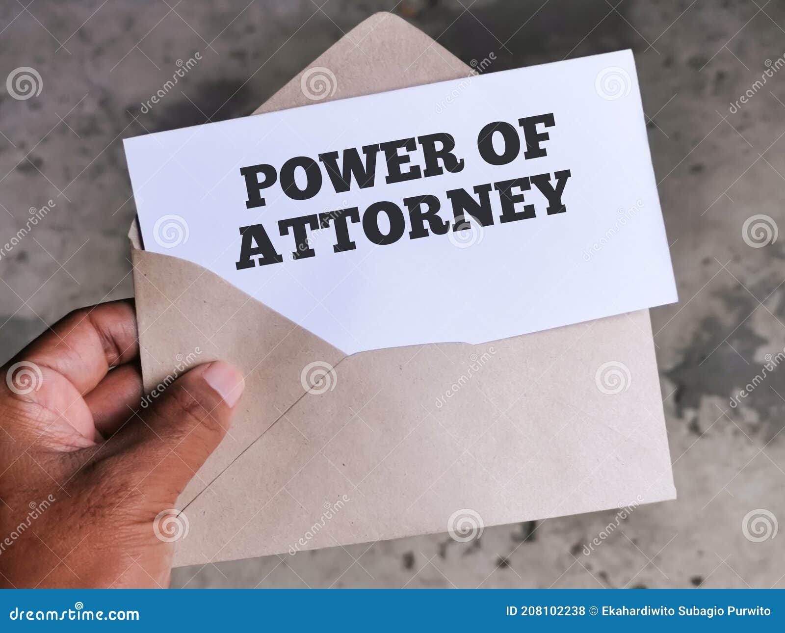 Hand Holding Envelope with White Card Written Text POWER of ATTORNEY ...