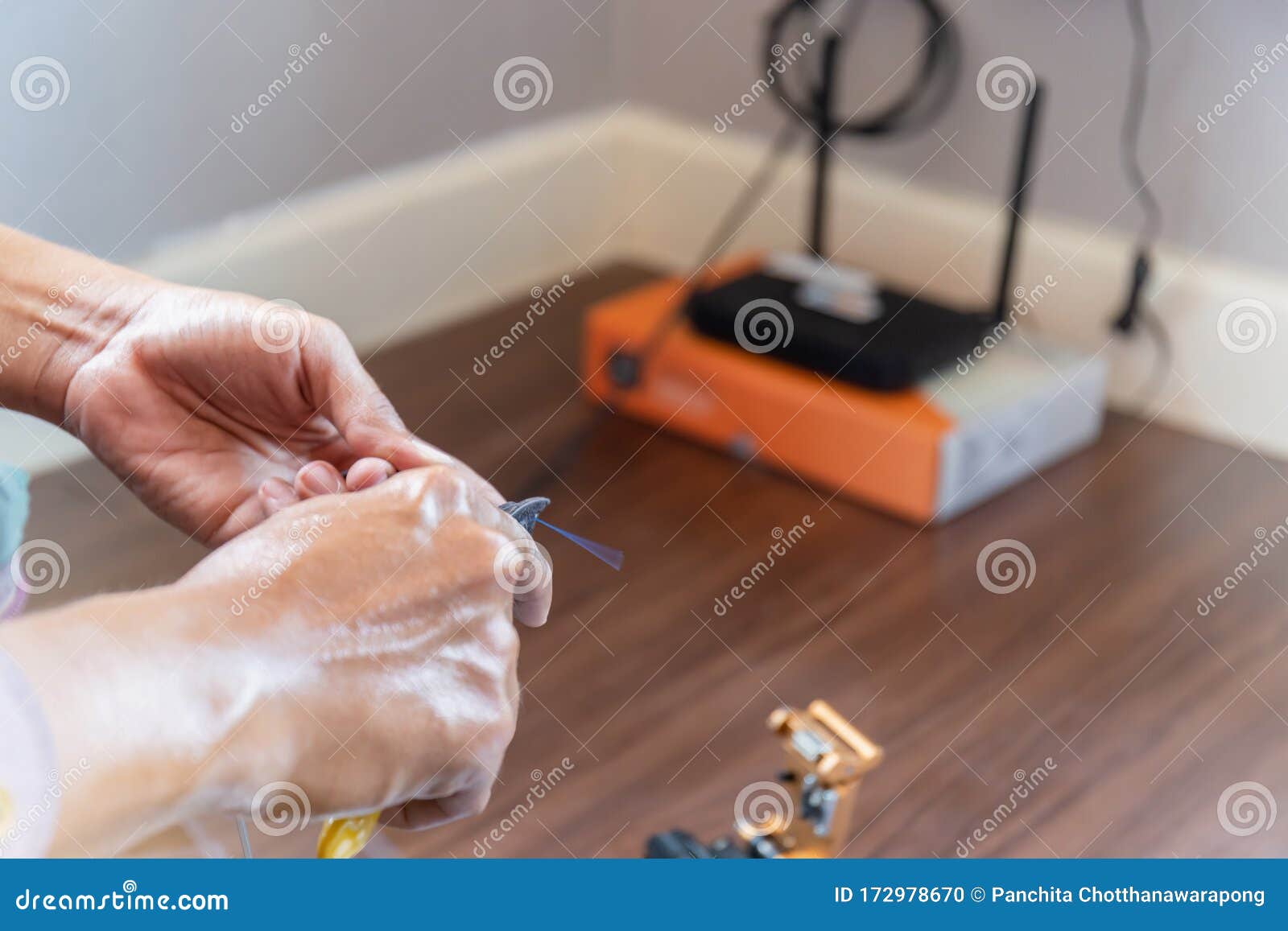 Selective Focus of Internet Technician Man are Cutting and Installation ...