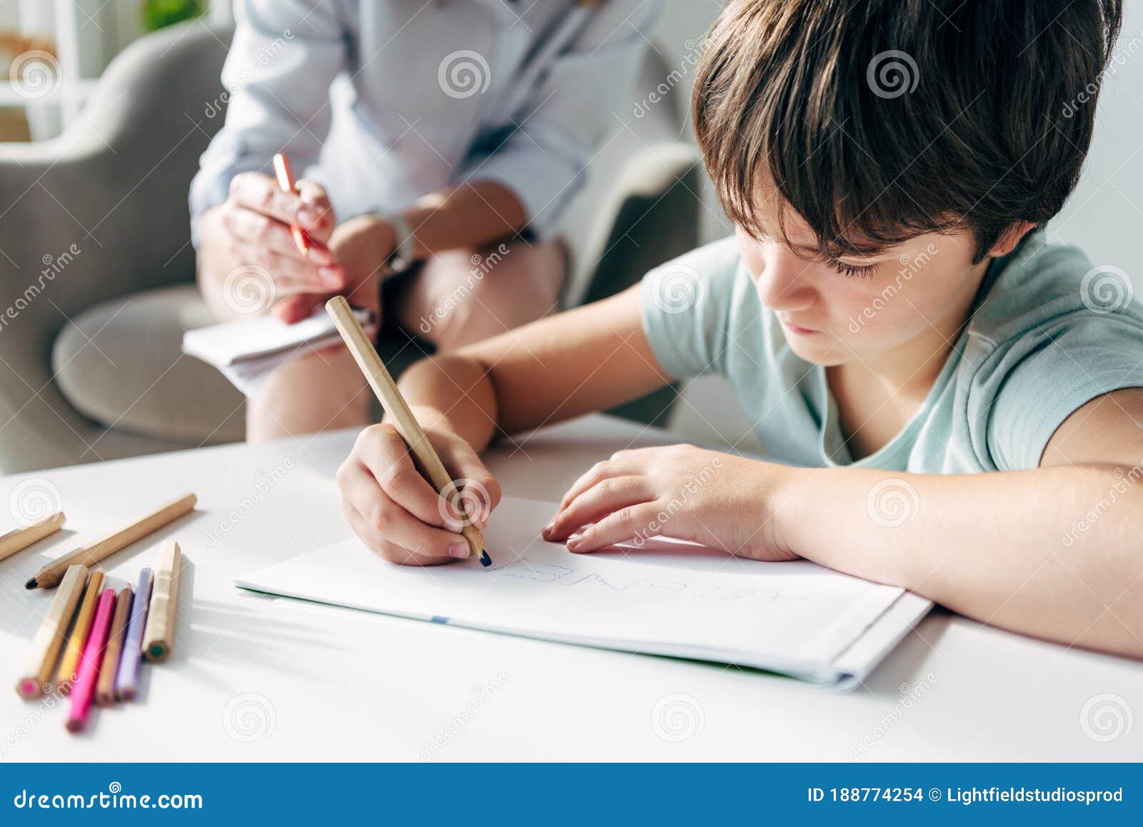 Focus of Kid with Dyslexia Drawing on Paper with Pencil Stock Photo ...