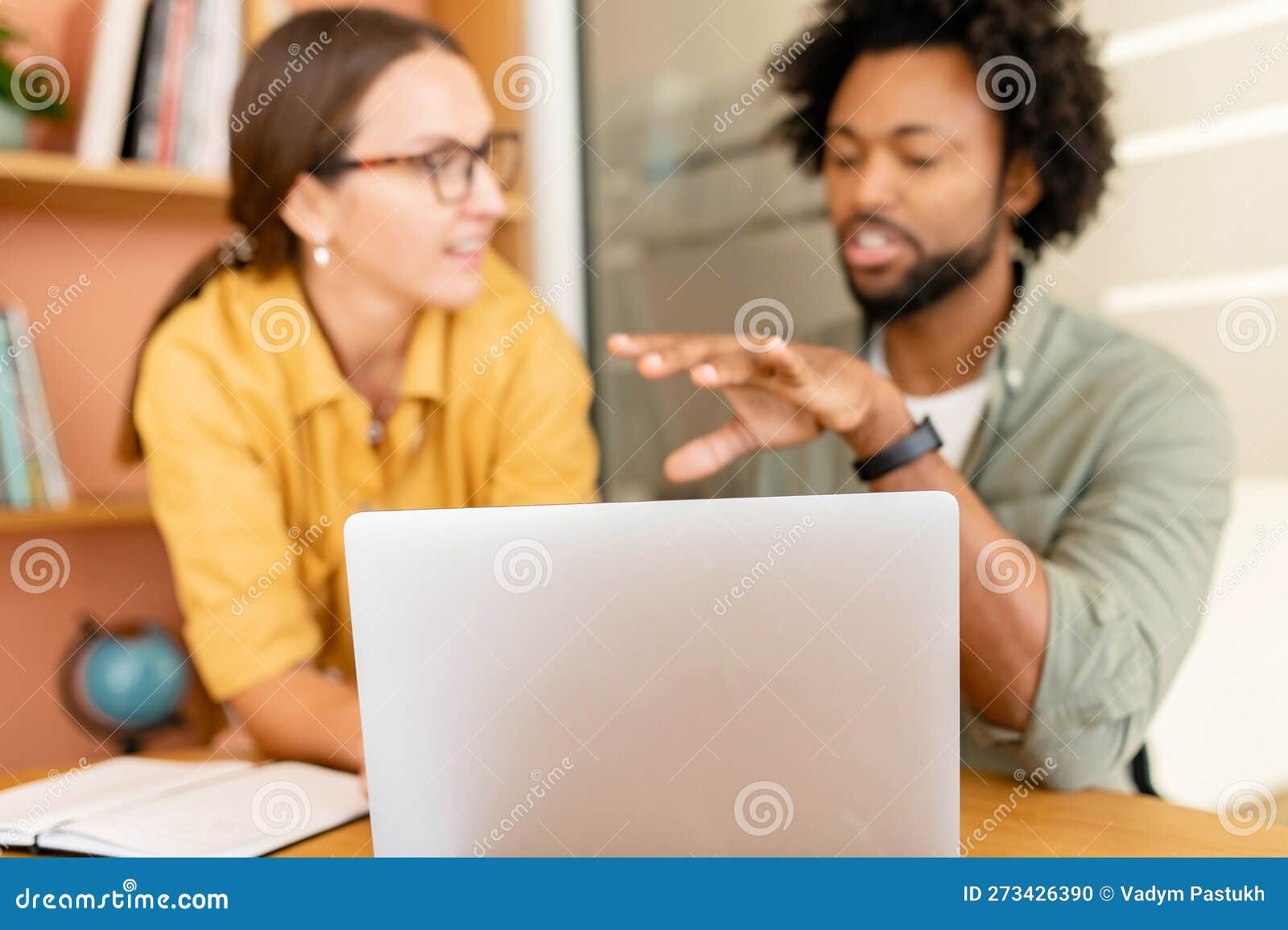 Selective Focus at the Laptop, Two Colleagues Have Discussion ...