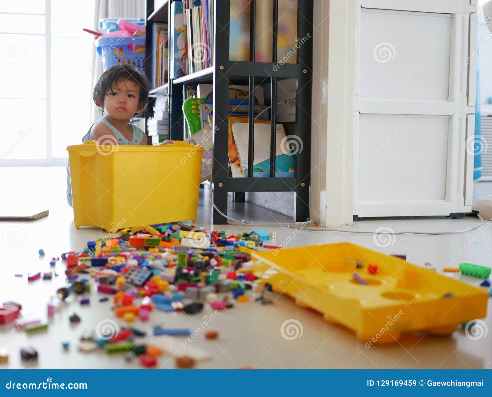 Selective Focus of a Little Asian Baby Girl Searching a Box of Toys and ... Selective Focus of a Little Asian Baby Girl Searching a Box of Toys and ...