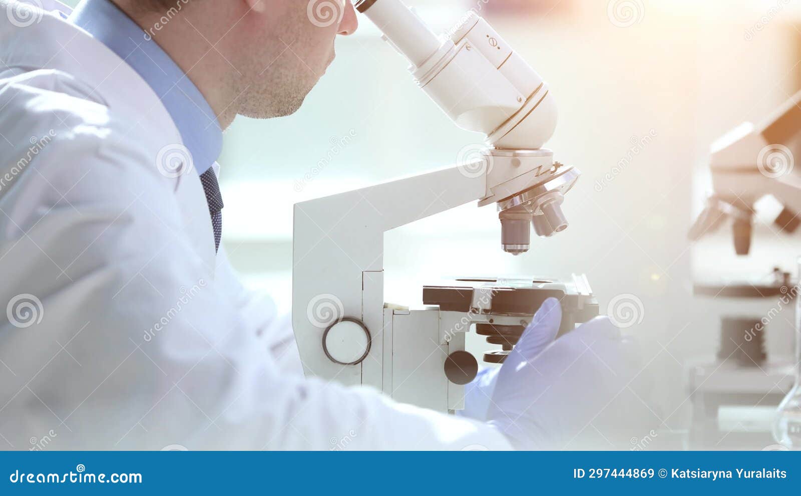 Selective Focus of Male Scientist Looking through Microscope in ...
