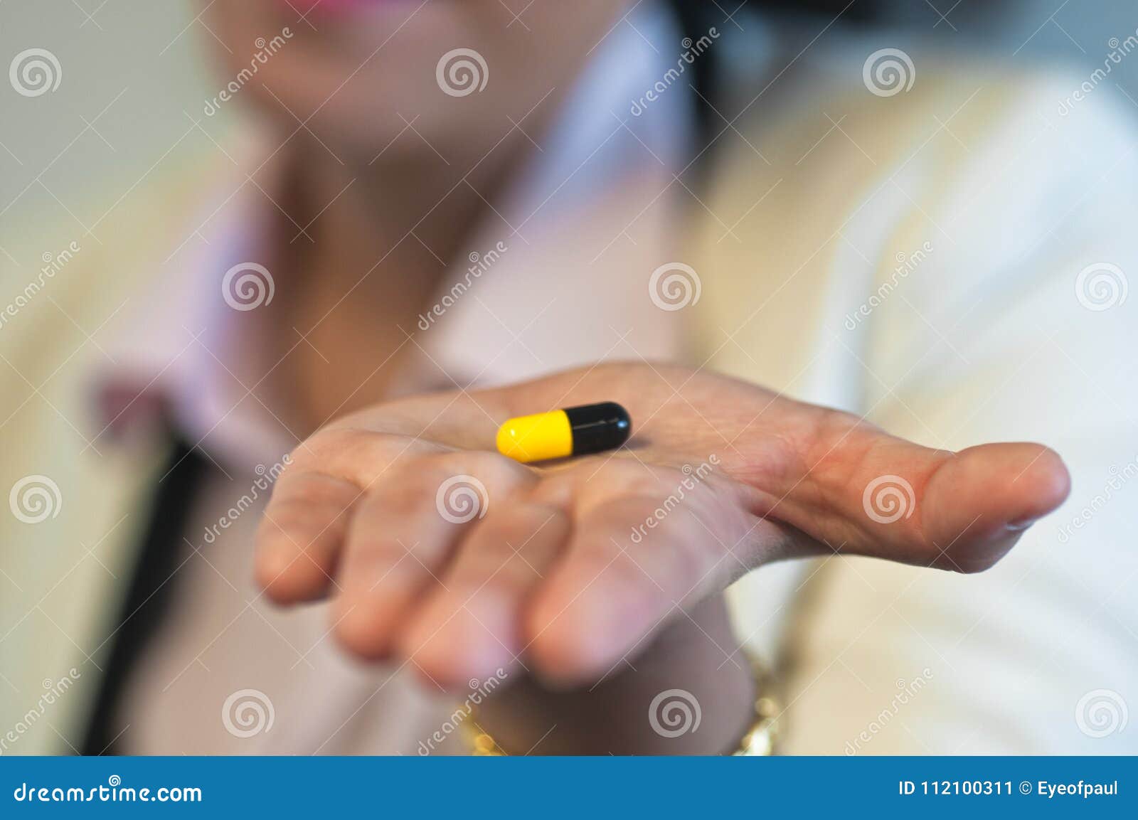 Medicine capsule on a hand stock image. Image of illness - 112100311