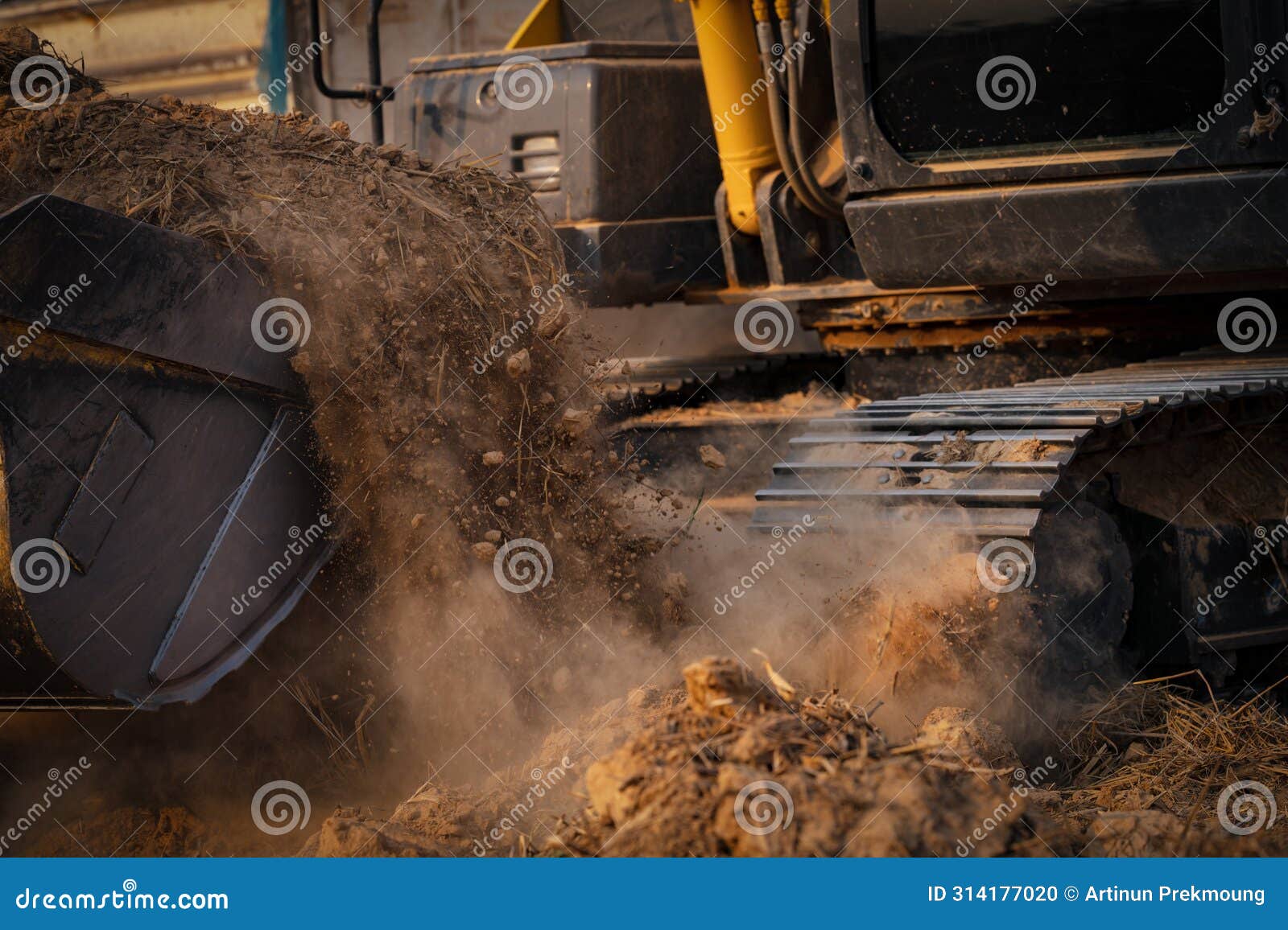 Selective Focus on Metal Bucket Teeth of Backhoe Digging Soil. Backhoe ...