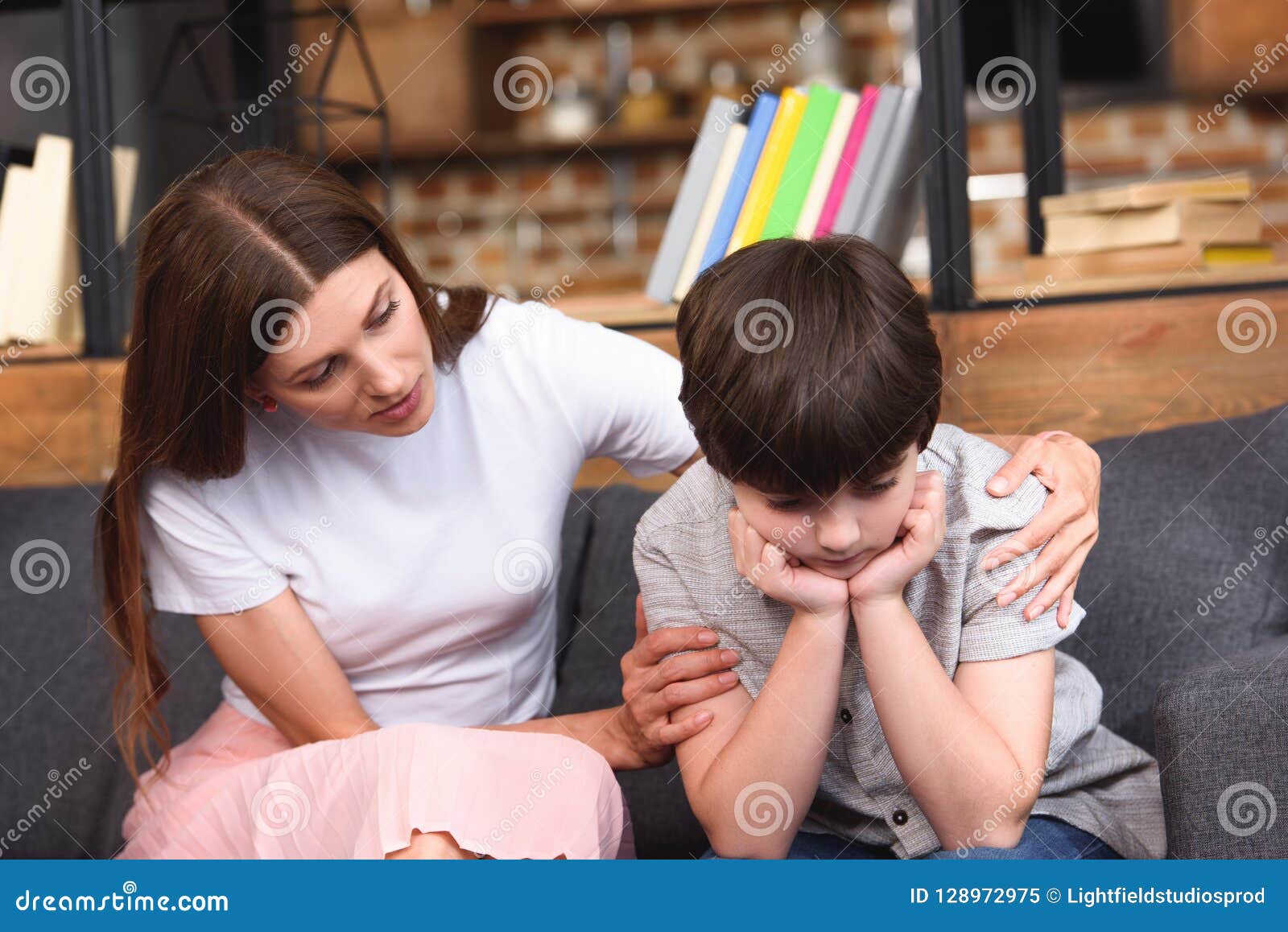 Mother Cheering Up Stressed Daughter On Family Therapy Session By ...