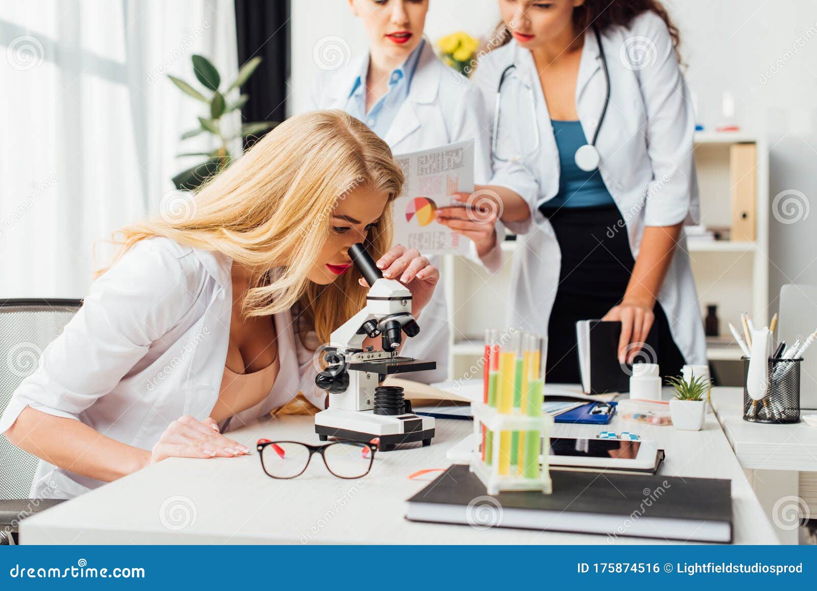 Selective Focus of Nurse Looking through Stock Photo - Image of flora ...