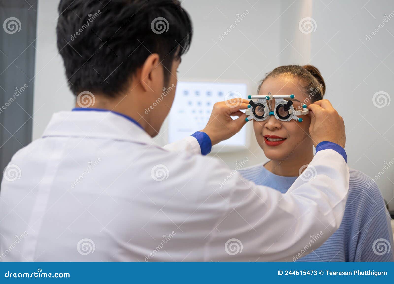 Selective Focus at Optometrist Face. while Doctor Using Penlight and ...