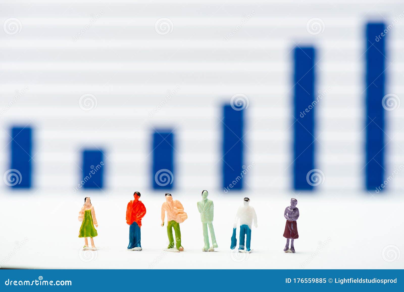 Selective Focus of People Figures on White Surface with Infographics at ...