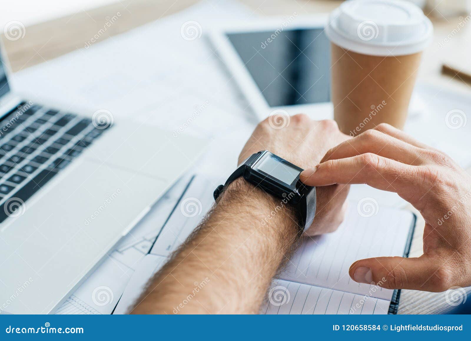 Selective Focus of Person Using Smartwatch at Workplace, Stock Photo ...