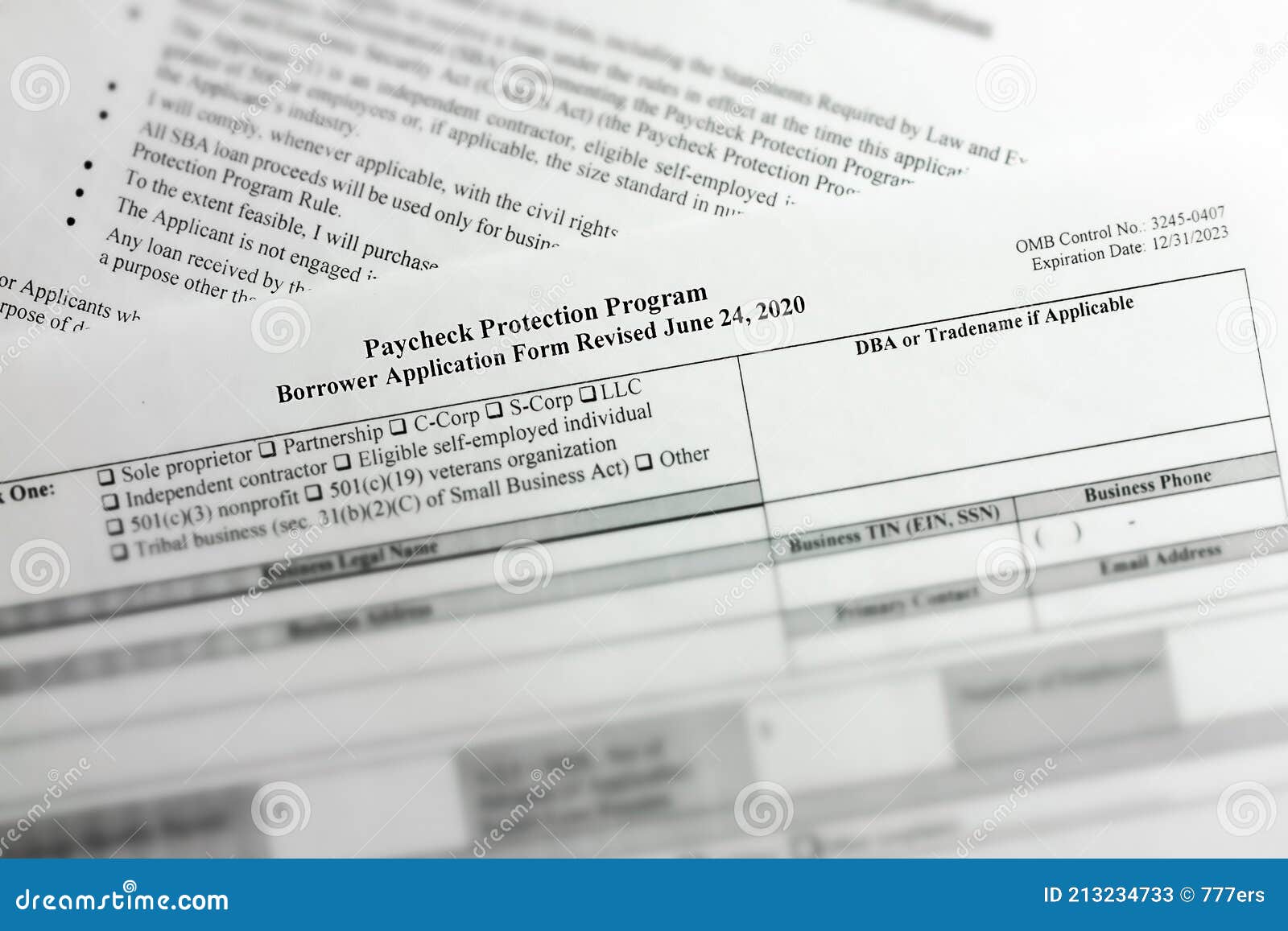 Selective Focus Photo of Paycheck Protection Program Borrower Application Form Revised. Paycheck ...