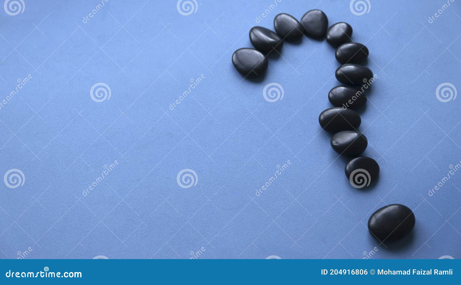 Selective Focus of Question Mark Symbol by Black Stone on Blue ...