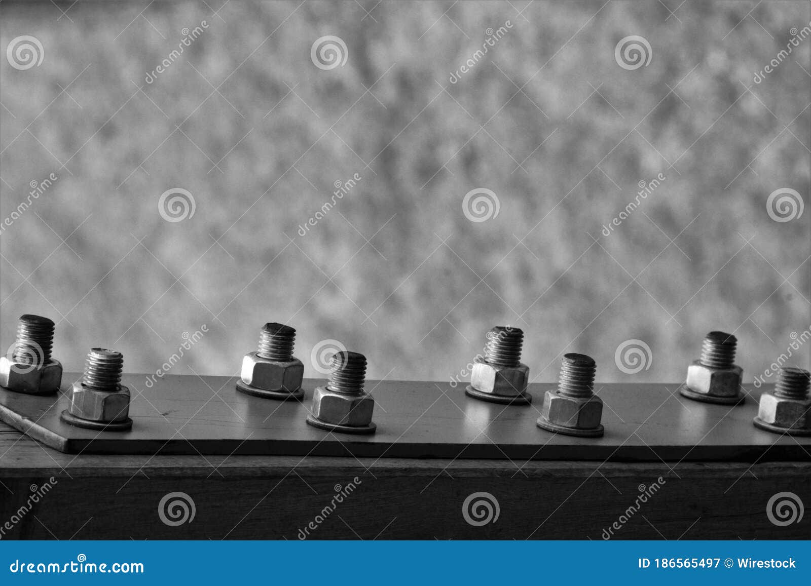 Selective Focus of Rows of Bolts in a Piece of Metal Stock Image ...
