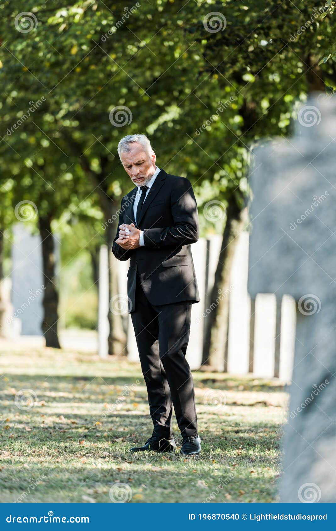 Focus of Sad Elderly Man Standing on Graveyard Stock Photo - Image of ...