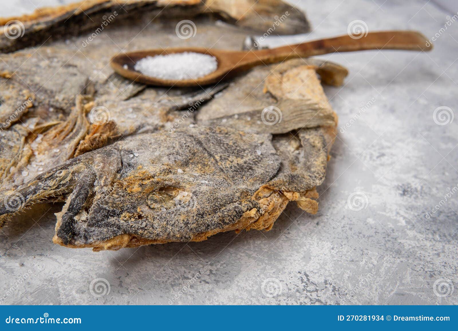 Selective Focus of a Salted Cod Head with a Wooden Spoon with Grains of ...