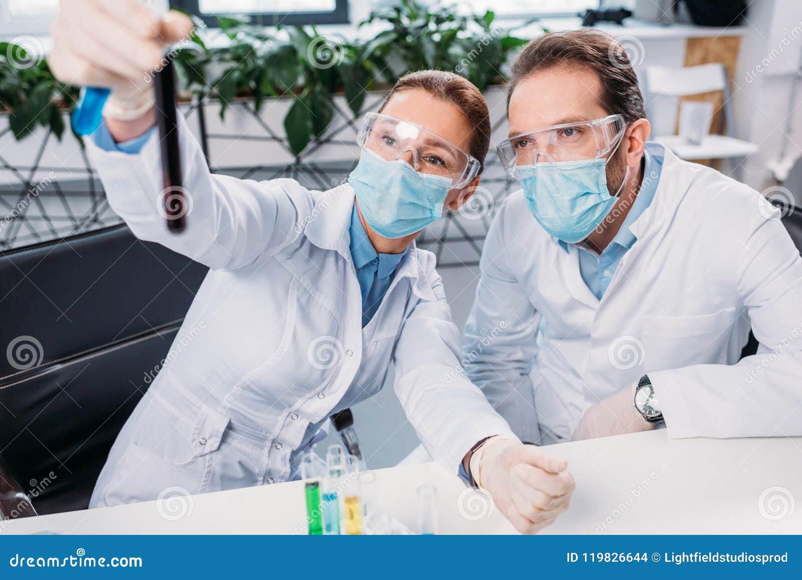 Selective Focus of Scientists Looking at Reagent Stock Photo - Image of ...