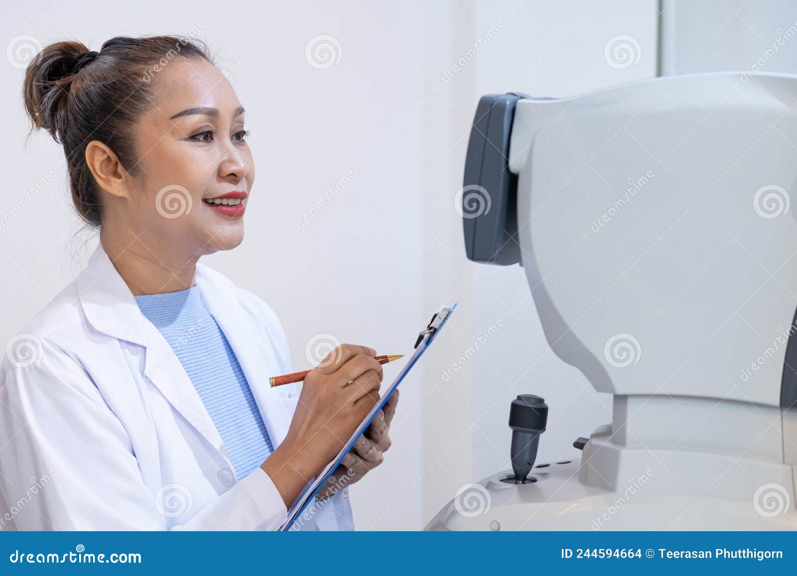 Selective Focus at Screen of Optometry Equipment. while Optometrist ...