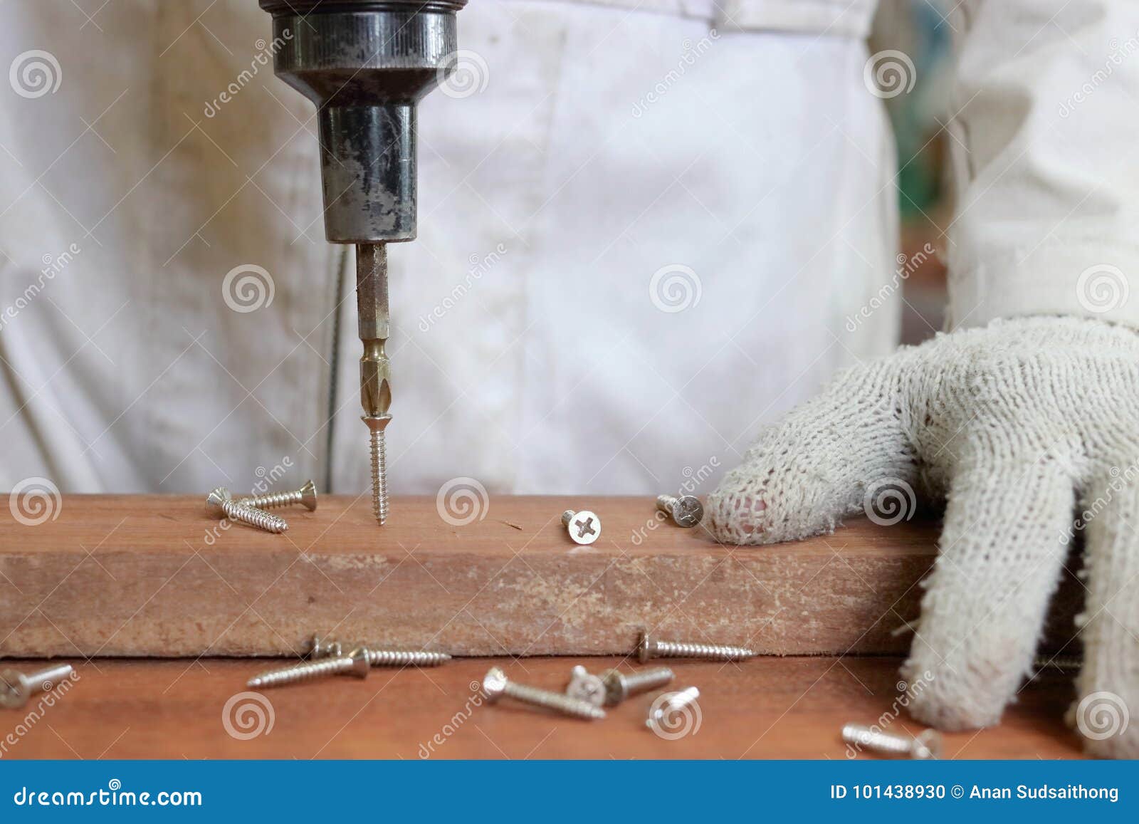 Selective Focus on Screws with Electric Tool Working with Hands of ...