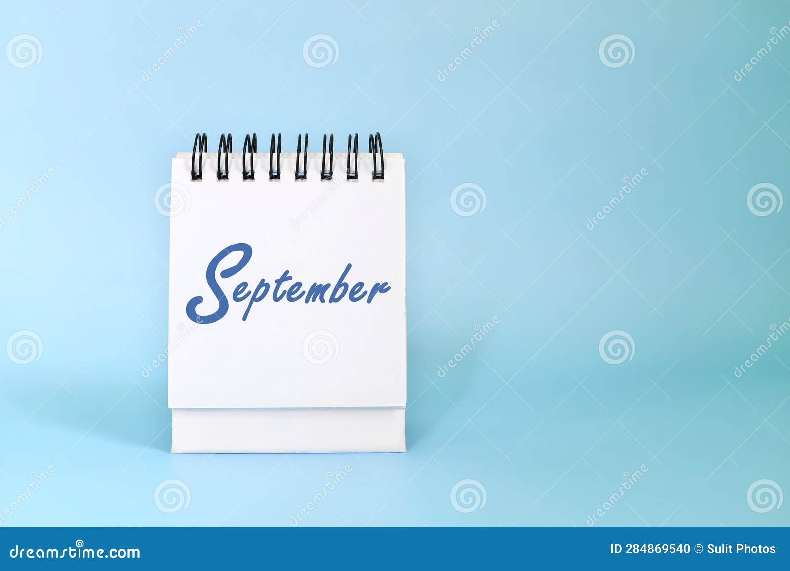 Selective Focus of September Month Desk Calendar on Blue Background ...
