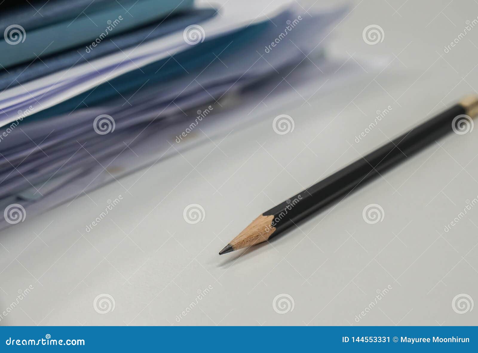 Sharp Pencil with Business Documents Pile on Office Desk Stock Image ...