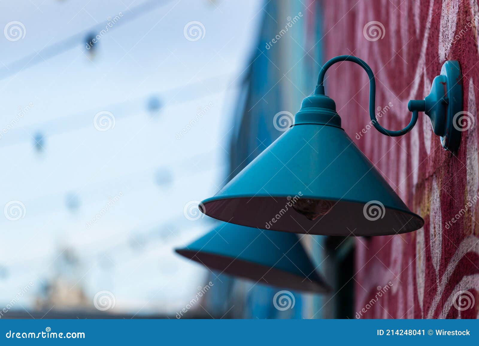 Selective Focus Shot of Blue Lamp Post Against the Wall Stock Image ...
