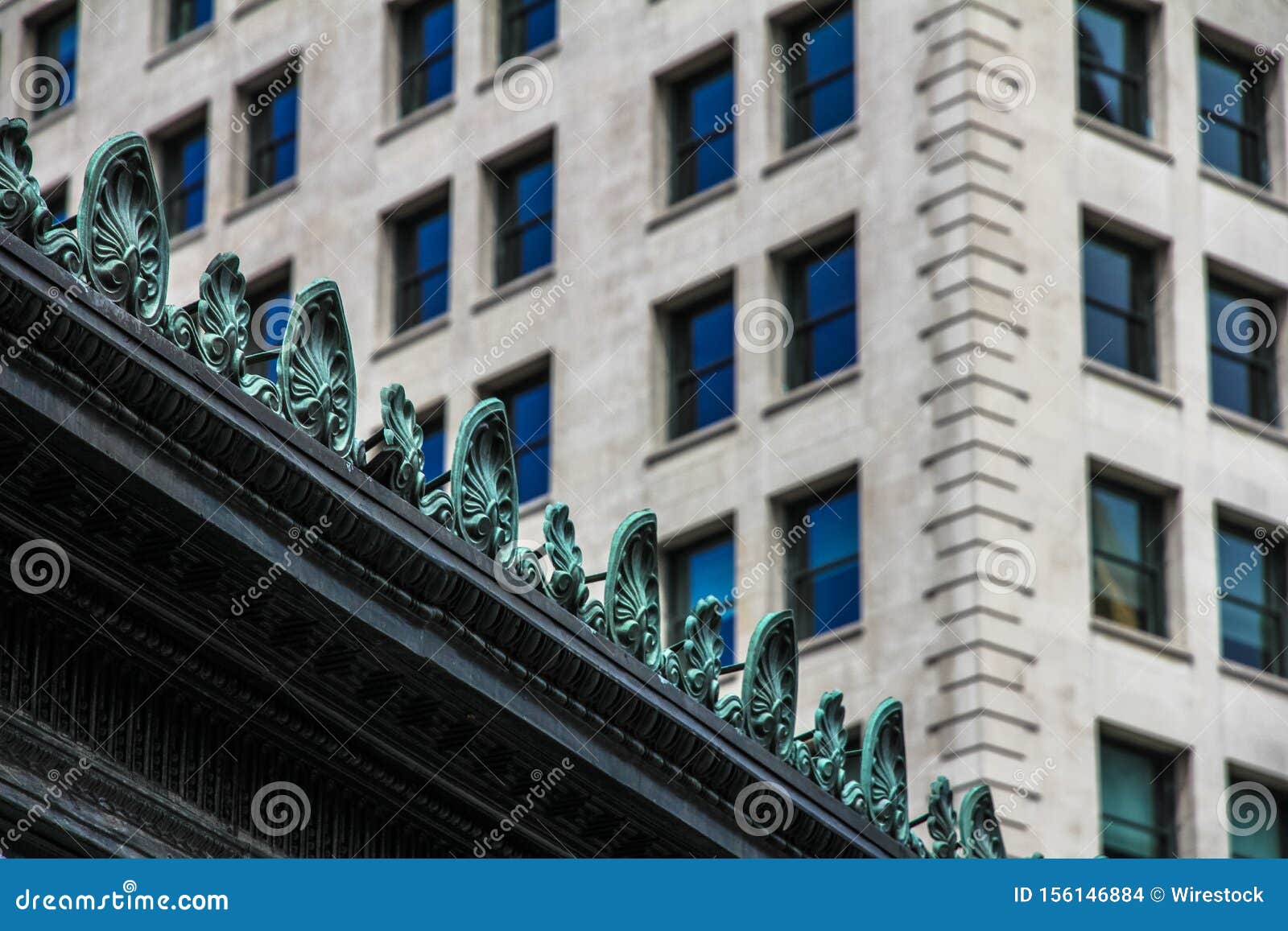 Selective Focus Shot of a Building`s Roof with a Blurred White Building ...