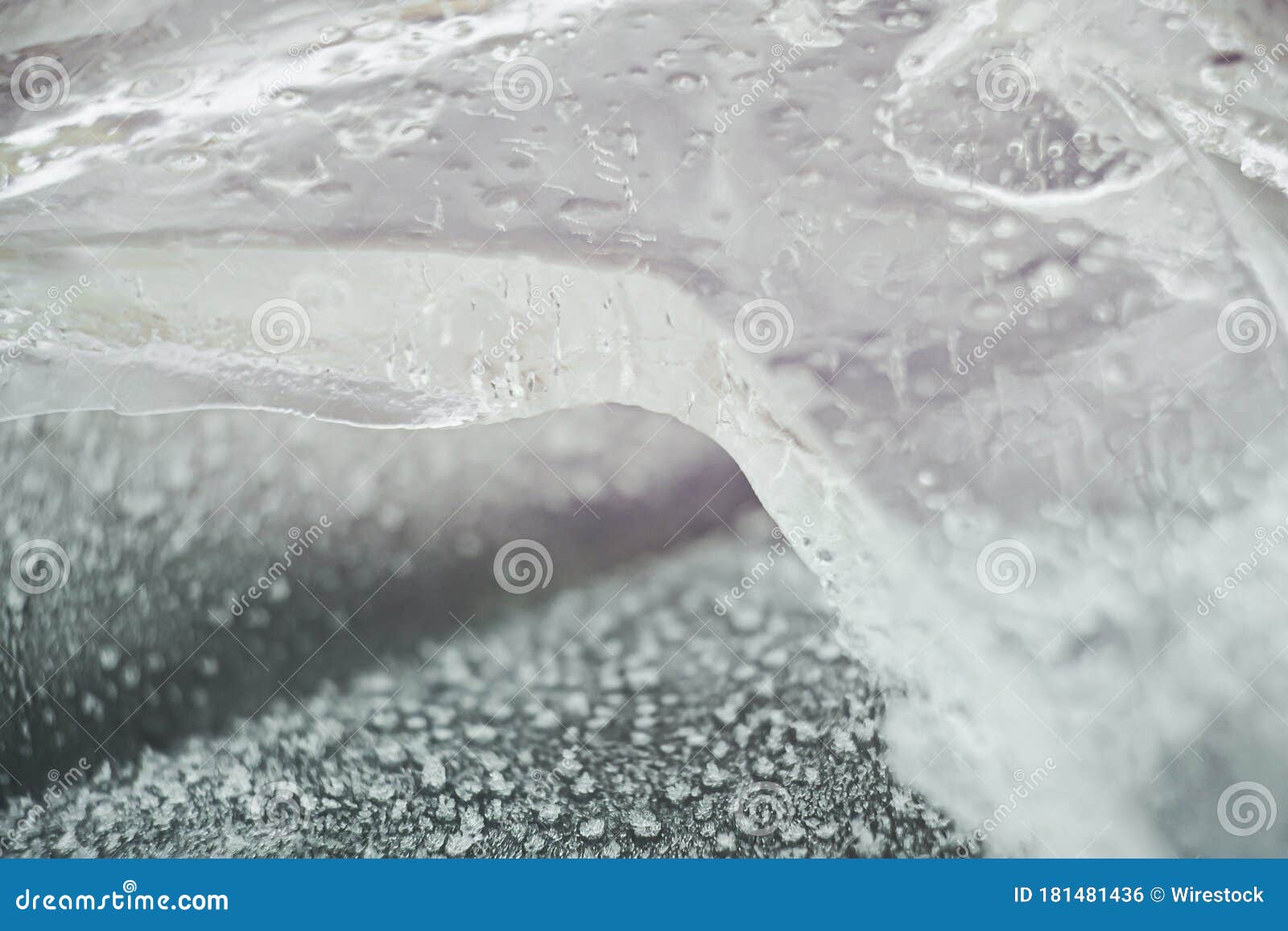 Selective Focus Shot of a Piece of Curved Melting Ice Stock Photo ...
